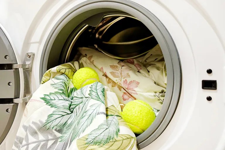Why Throwing a Tennis Ball in the Dryer Is the Ultimate Laundry Hack ...